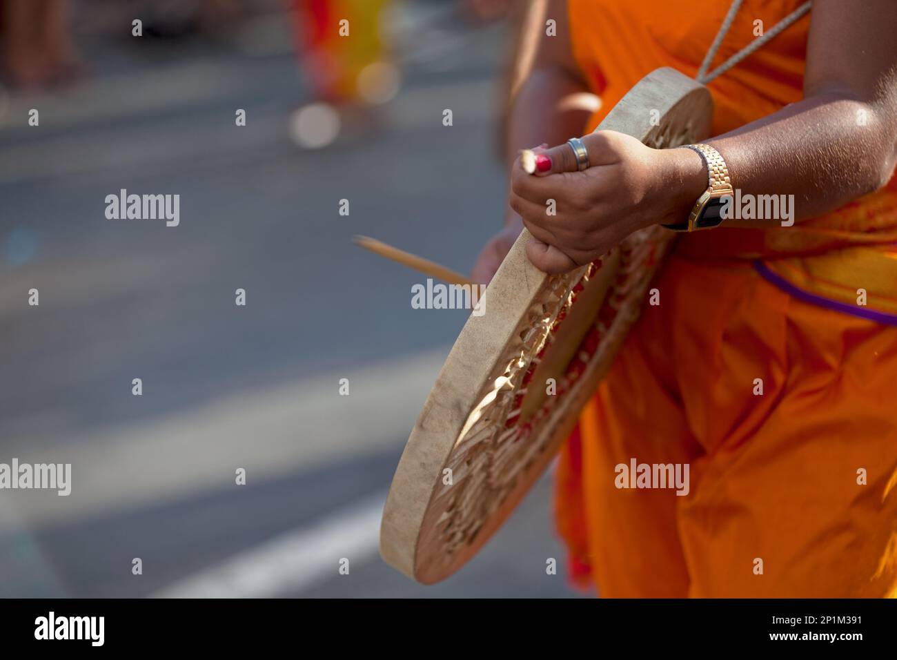 Musician playing with a malbar drum during the Grand Boucan carnival ...