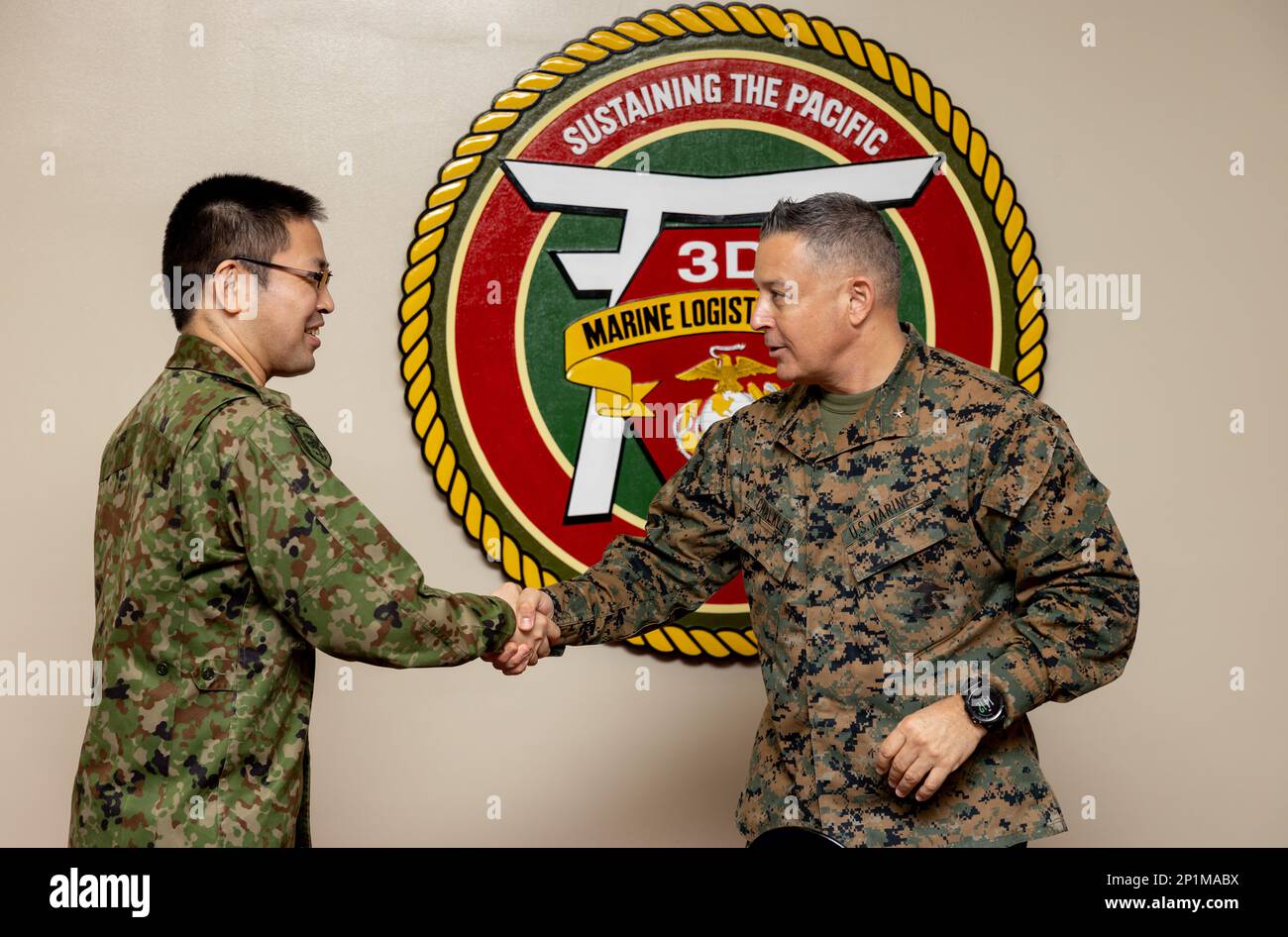U.S. Marine Corps Brig. Gen. Adam Chalkley, right, commanding general ...