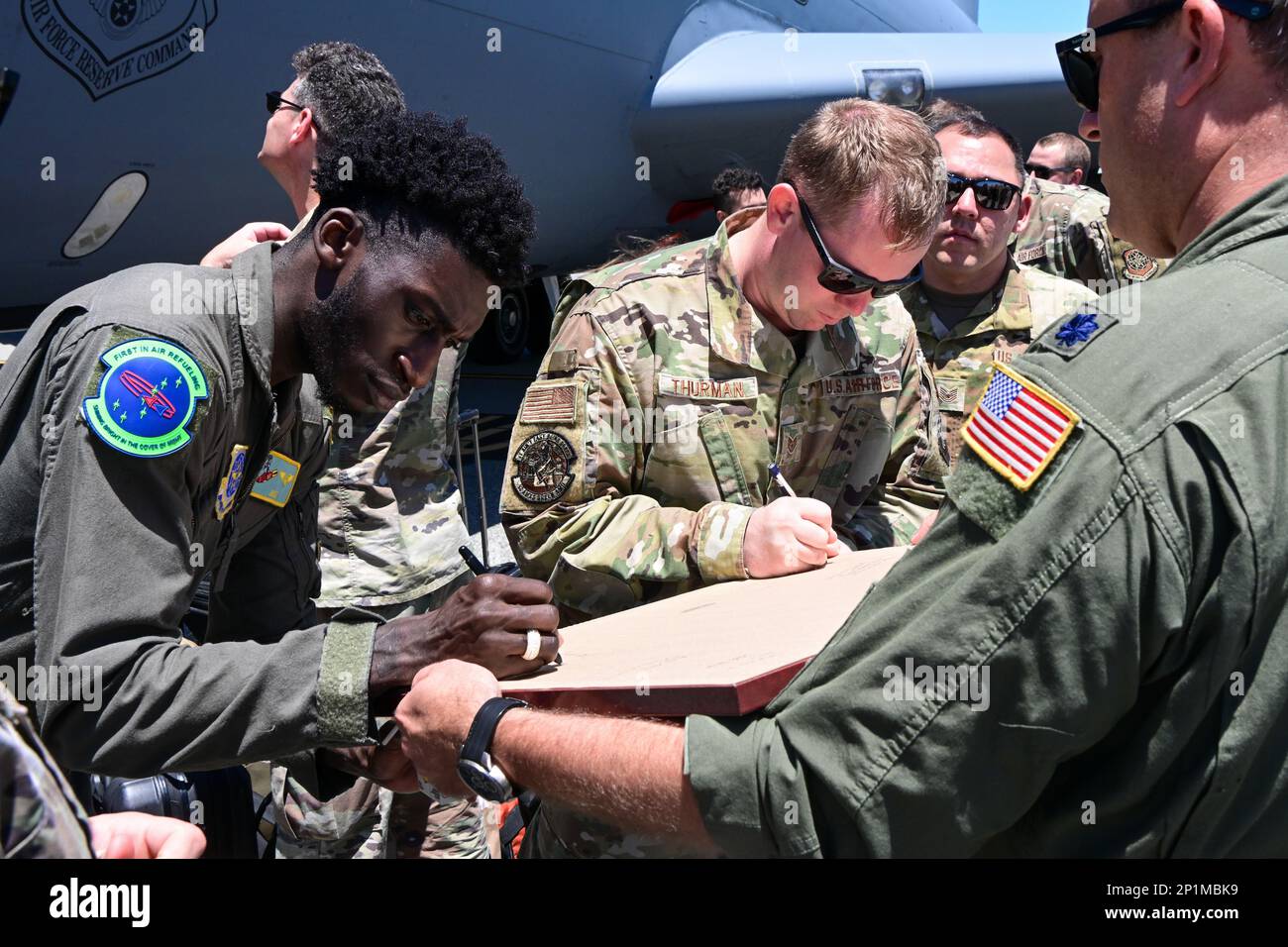 U.S. Air Force Senior Airman Jenson Kokou, left, a boom operator ...