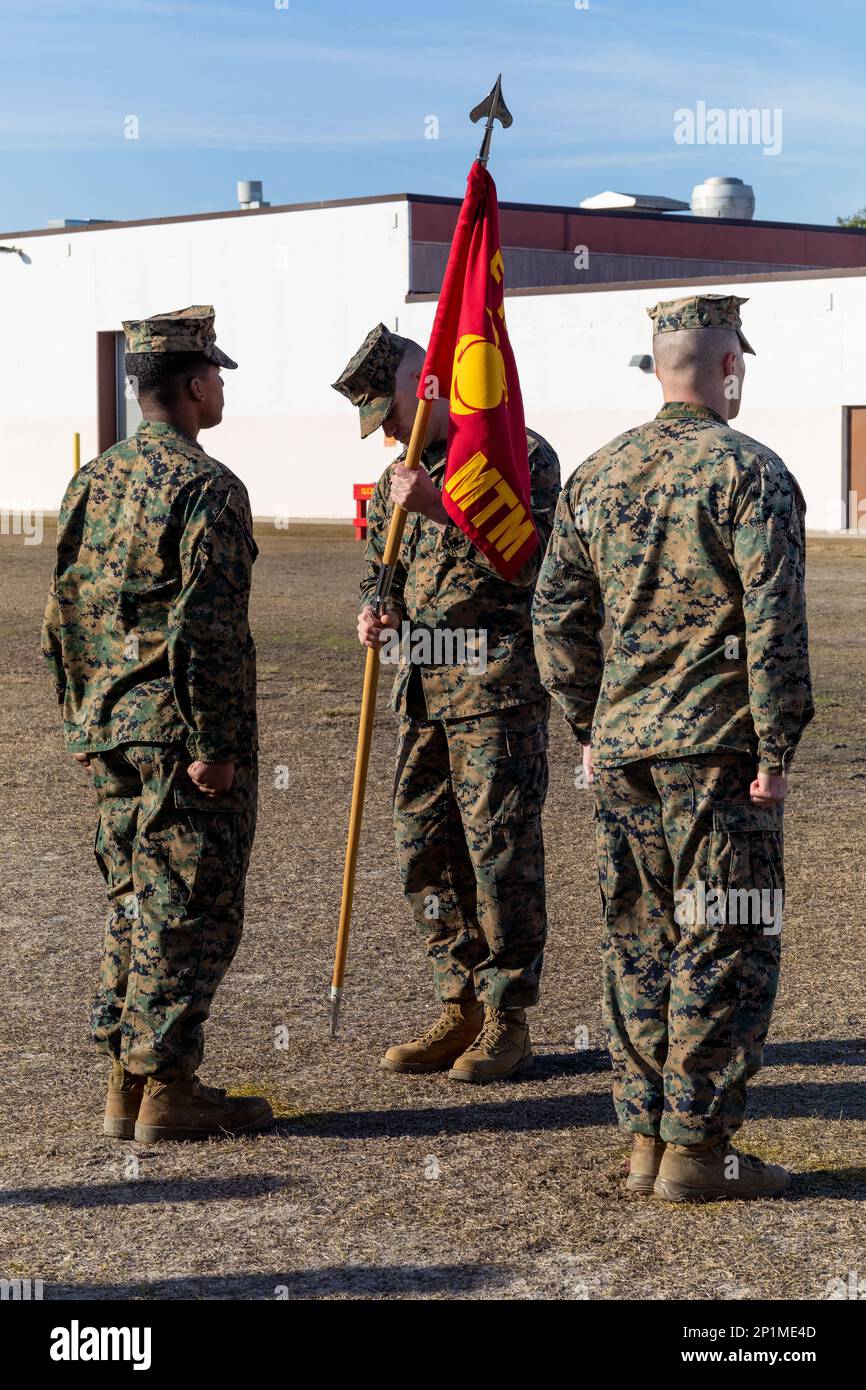 U.S. Marine Corps 1st Sgt. Paris Skidmore, center, the company first ...