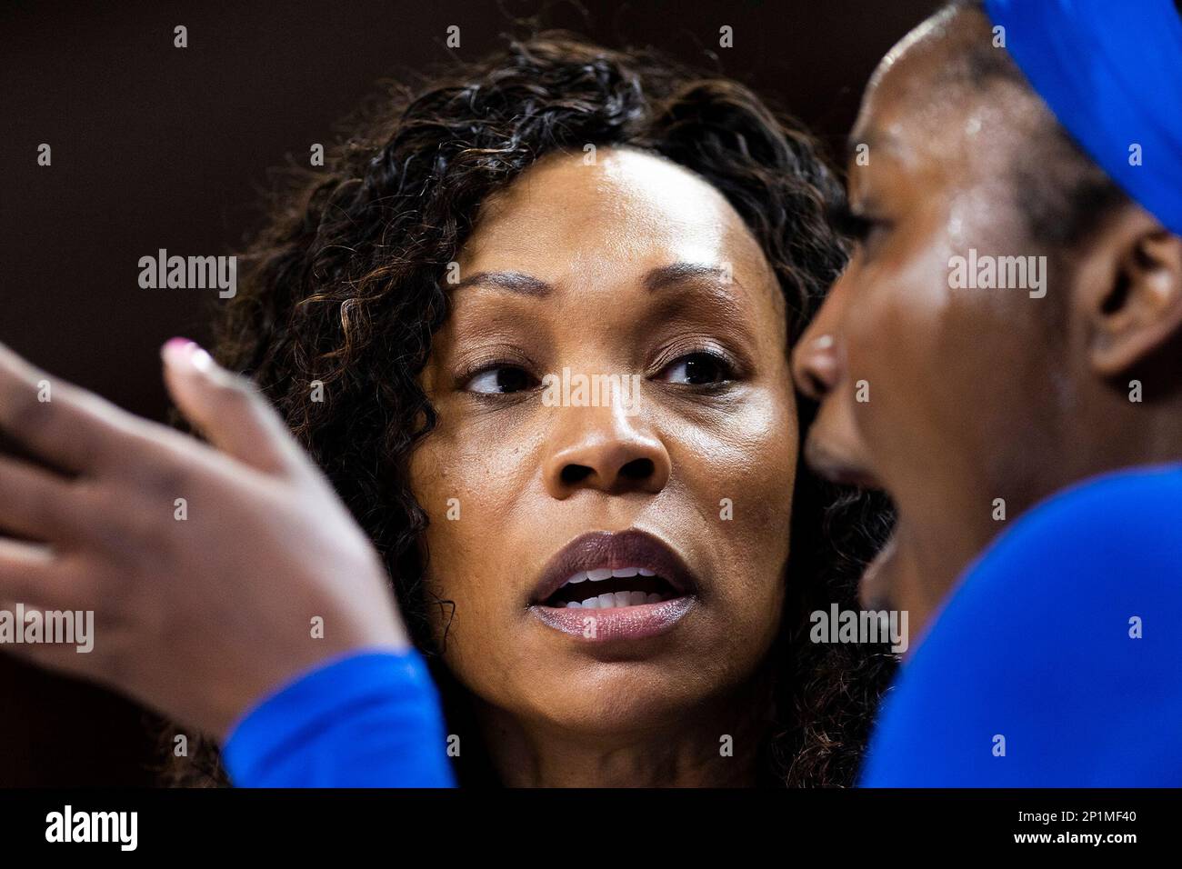 Kentucky head coach Kyra Elzy, left, talks with player Adebola Adeyeye ...