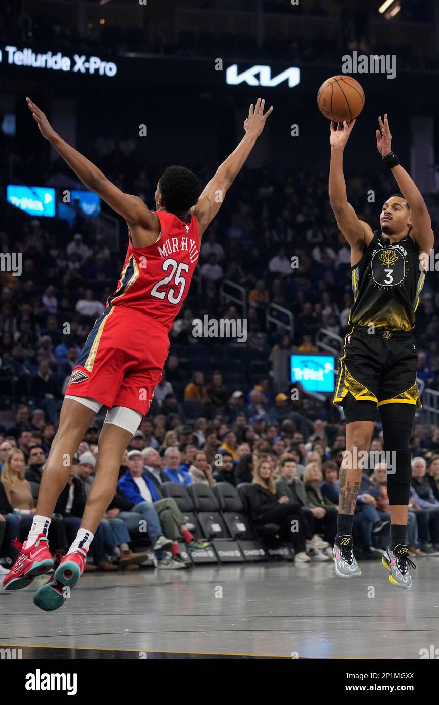 Golden State Warriors guard Jordan Poole, right, shoots a 3-point ...