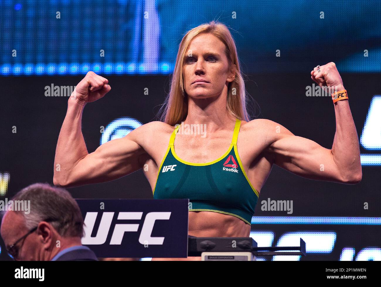 UFC women's bantamweight champion Holly Holm flexes during the UFC 196 ...