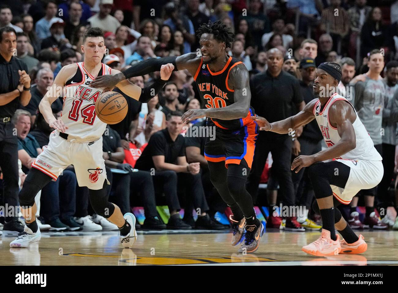 Miami Heat guard Tyler Herro (14) and forward Jimmy Butler, right ...