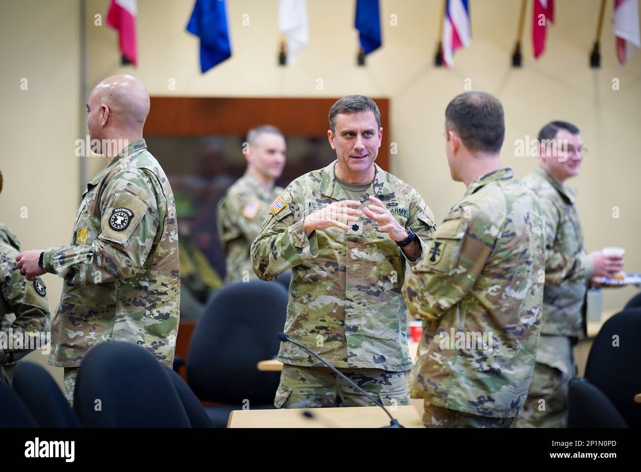Event attendees converse following the completion of the Reserve ...