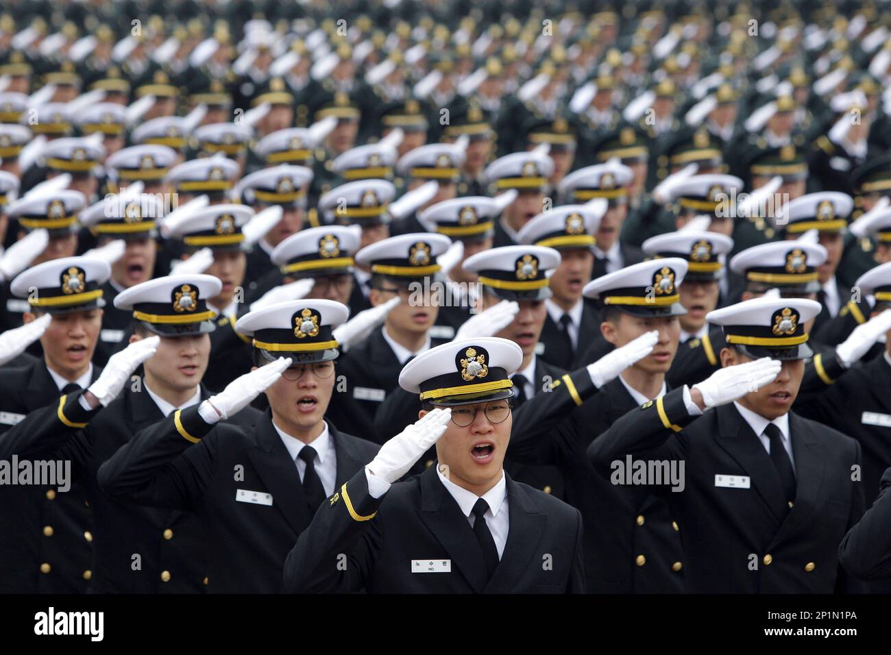 South Korean new military officers salute during a military ...