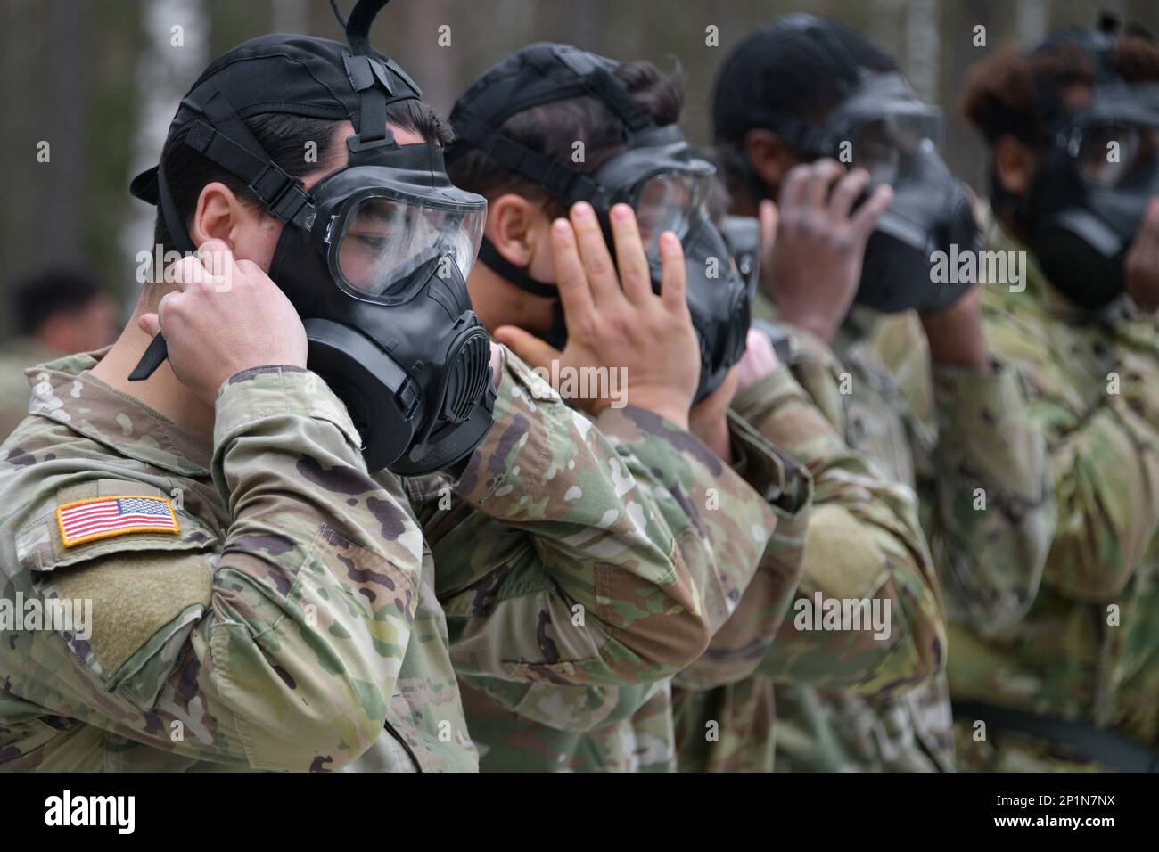 U.S. Soldiers with 207th Military Intelligence Brigade apply their gas ...