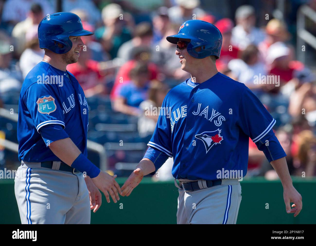 Toronto Blue Jays third baseman Matt Dominguez, right, is congratulated ...
