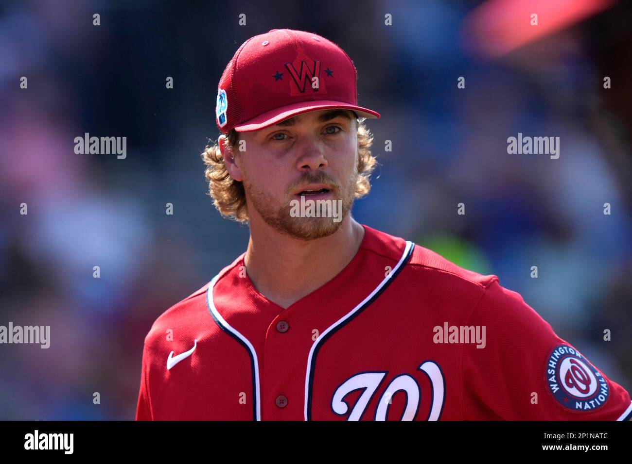 Washington Nationals starting pitcher Jake Irvin walks on the field ...