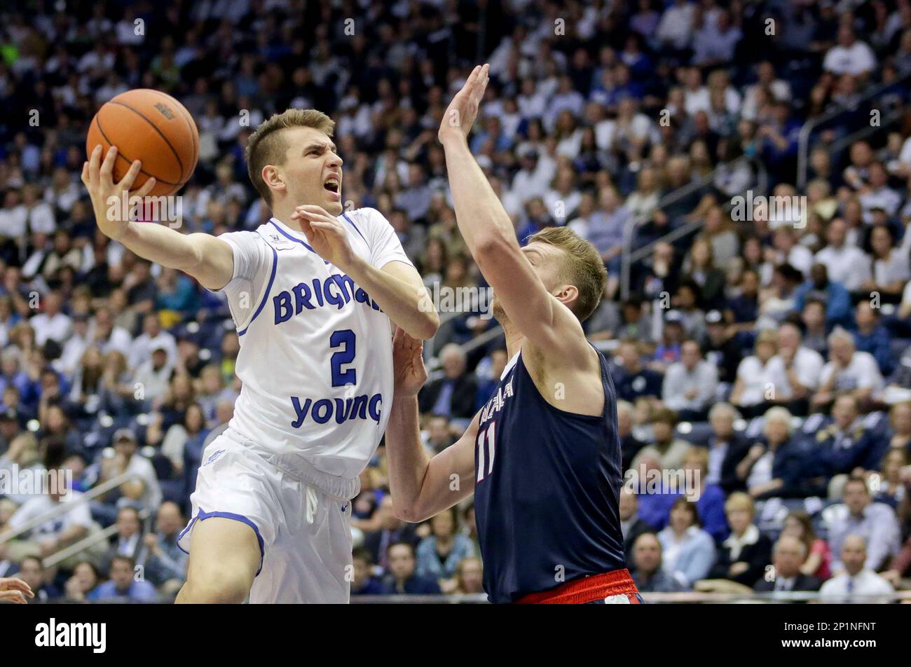 BYU guard Zac Seljaas (2) goes to the hoop over Gonzaga forward Domantas Sabonis (11) during an ...