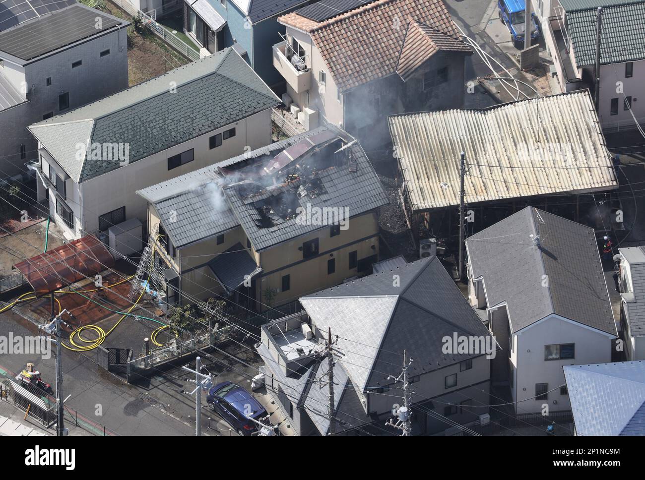 An aerial photo shows a fire at Fire at a residential area in Ayase ...