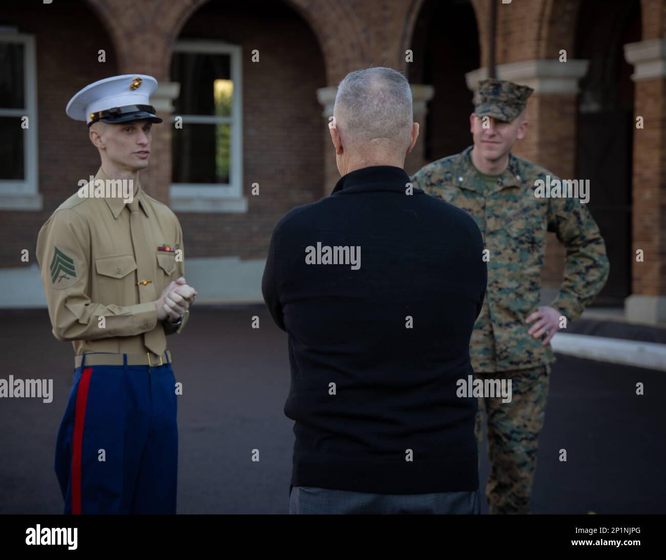 Sgt. Coleton R. Bihn, left, docent for the barracks, welcomes retired U ...