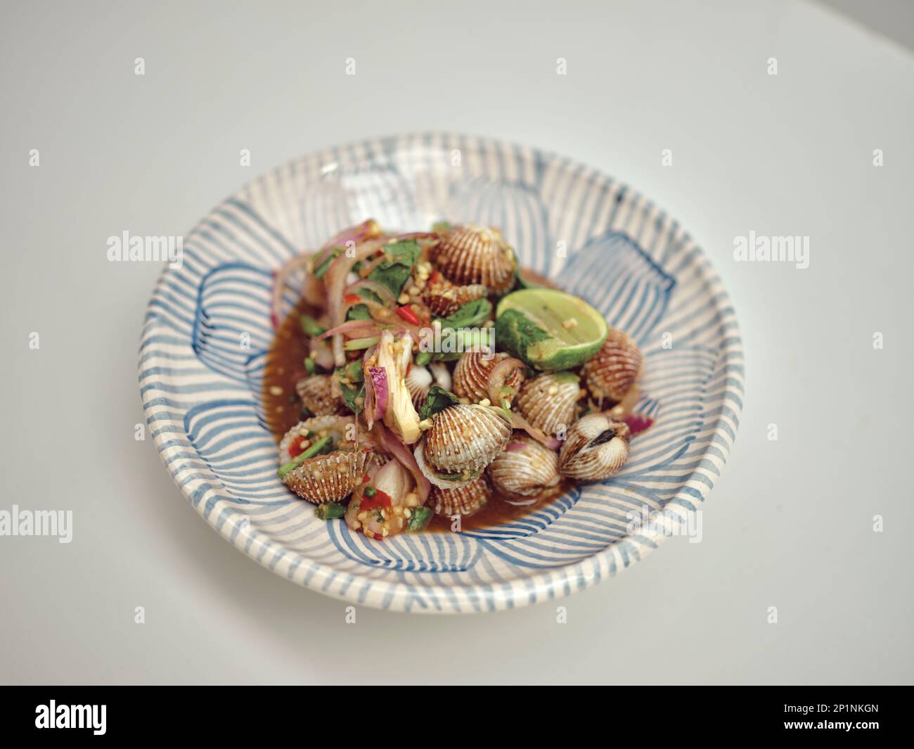 Thai street food , Spicy blood cockle salad Stock Photo - Alamy