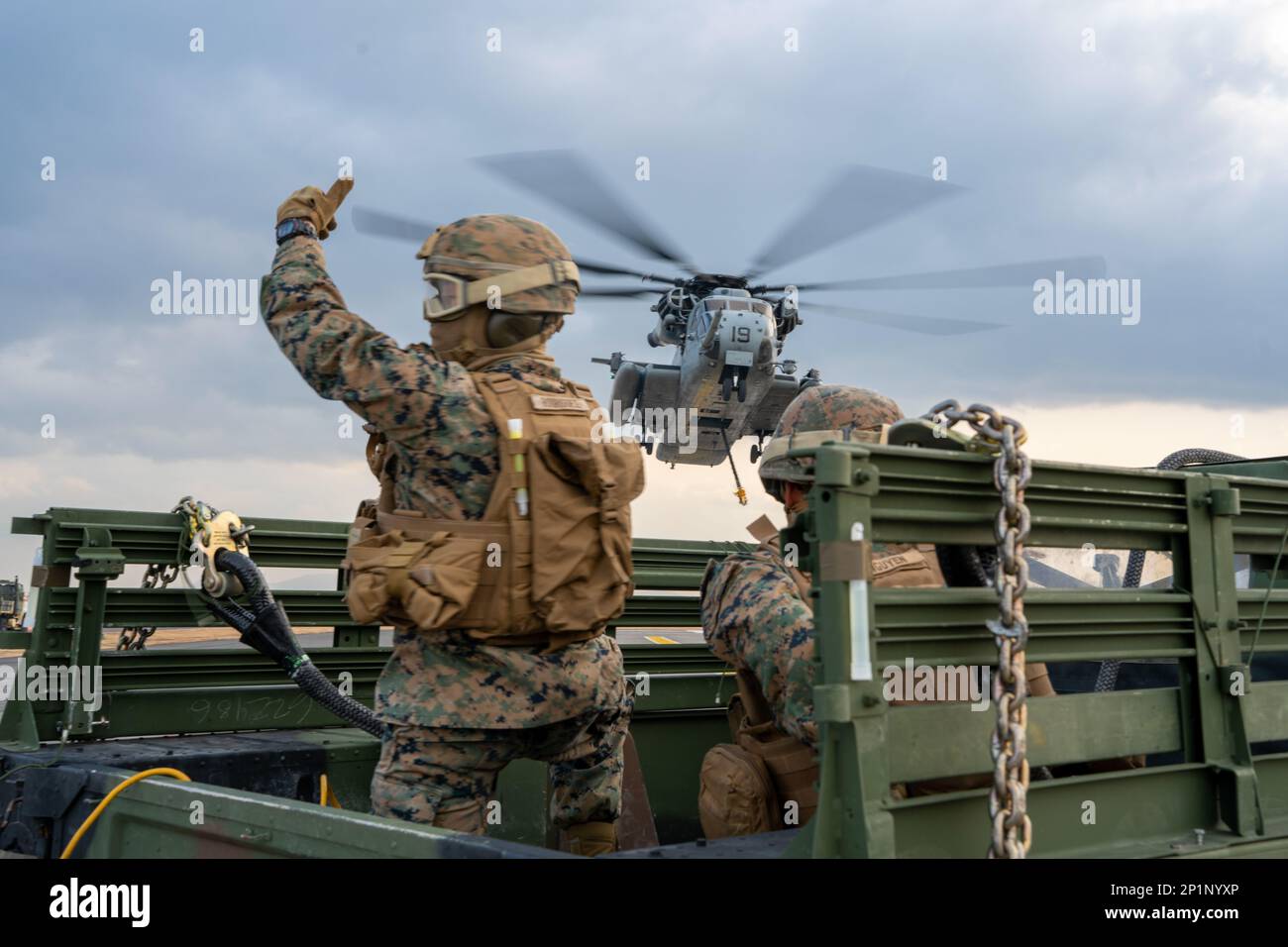 U.S. Marines with Combat Logistics Battalion 31 and a CH-53E Super ...