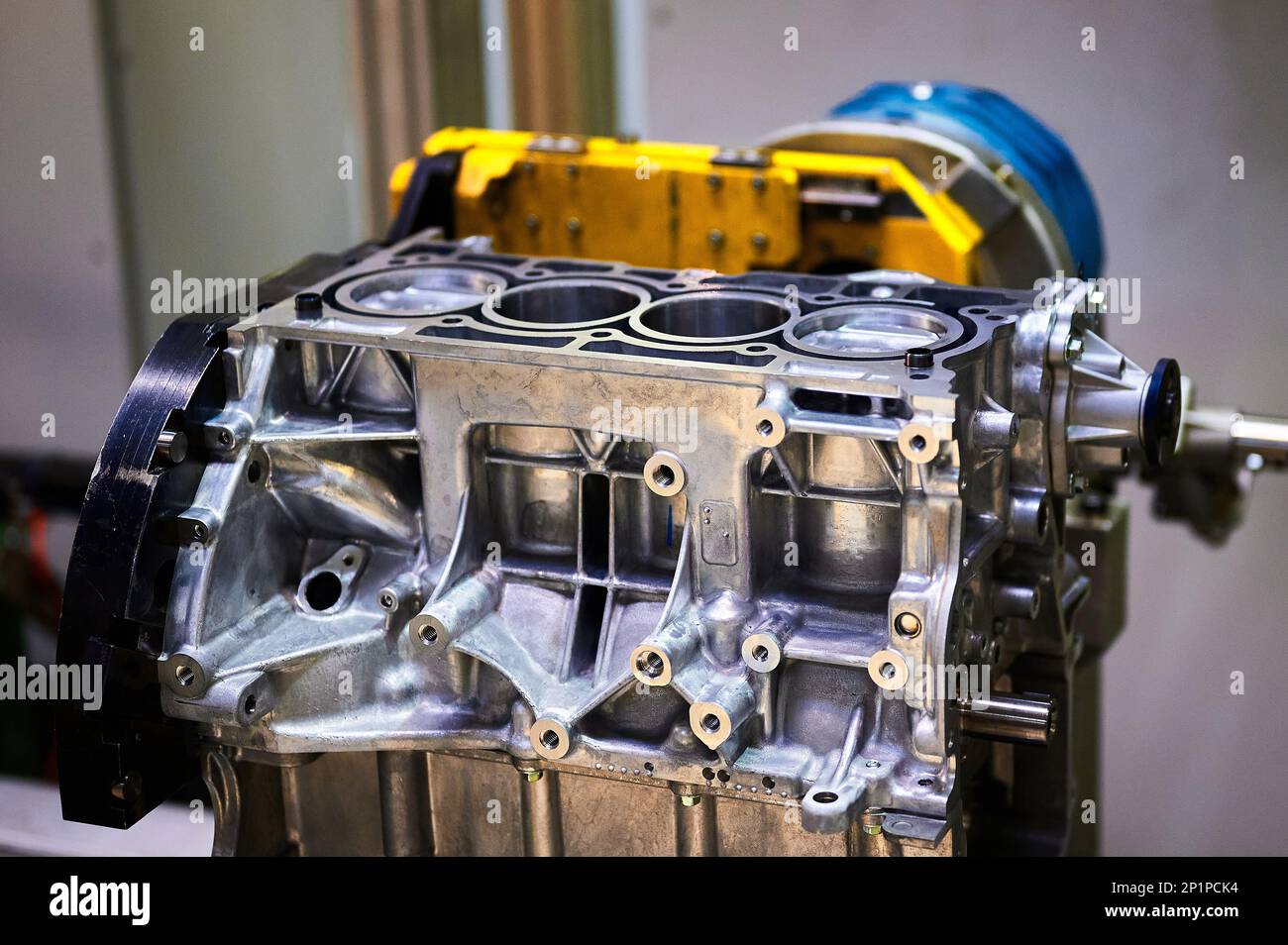 Engine cylinder block with installed pistons in workshop Stock Photo ...