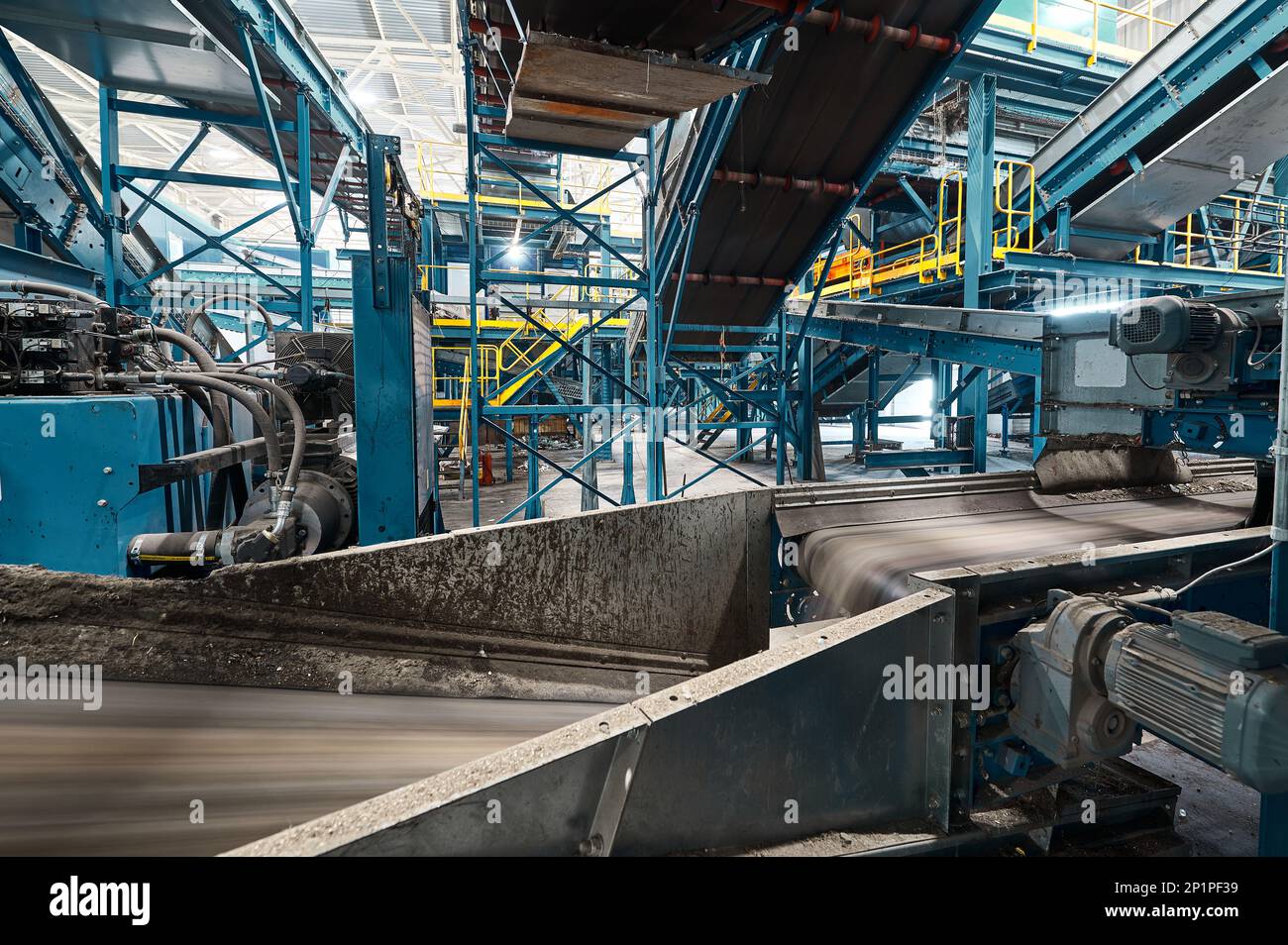 Large production line with conveyors carrying trash at plant Stock Photo - Alamy