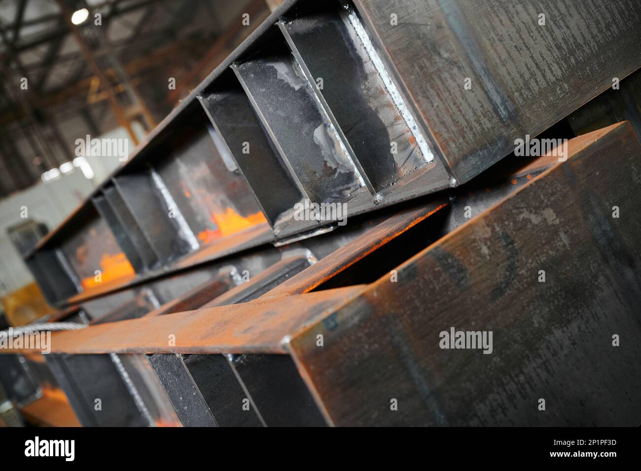 Welded fabrication made of beams stacked in plant warehouse Stock Photo ...