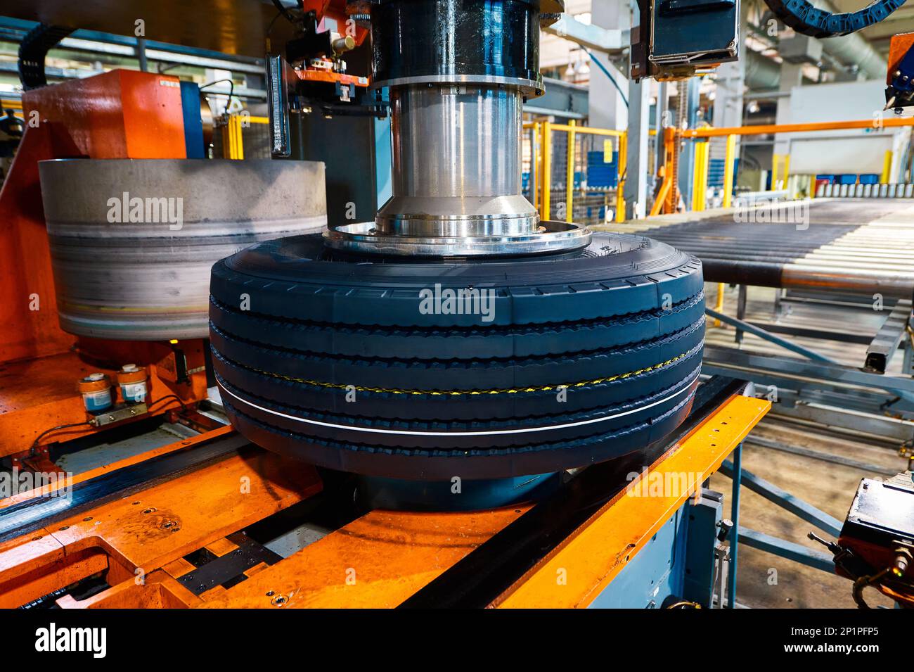 Tire with deep protector and marking on conveyor at plant Stock Photo ...