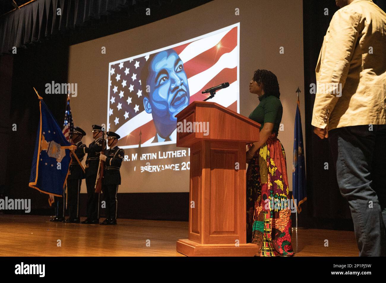 A woman sings the national anthem during a Dr. Martin Luther King Jr ...