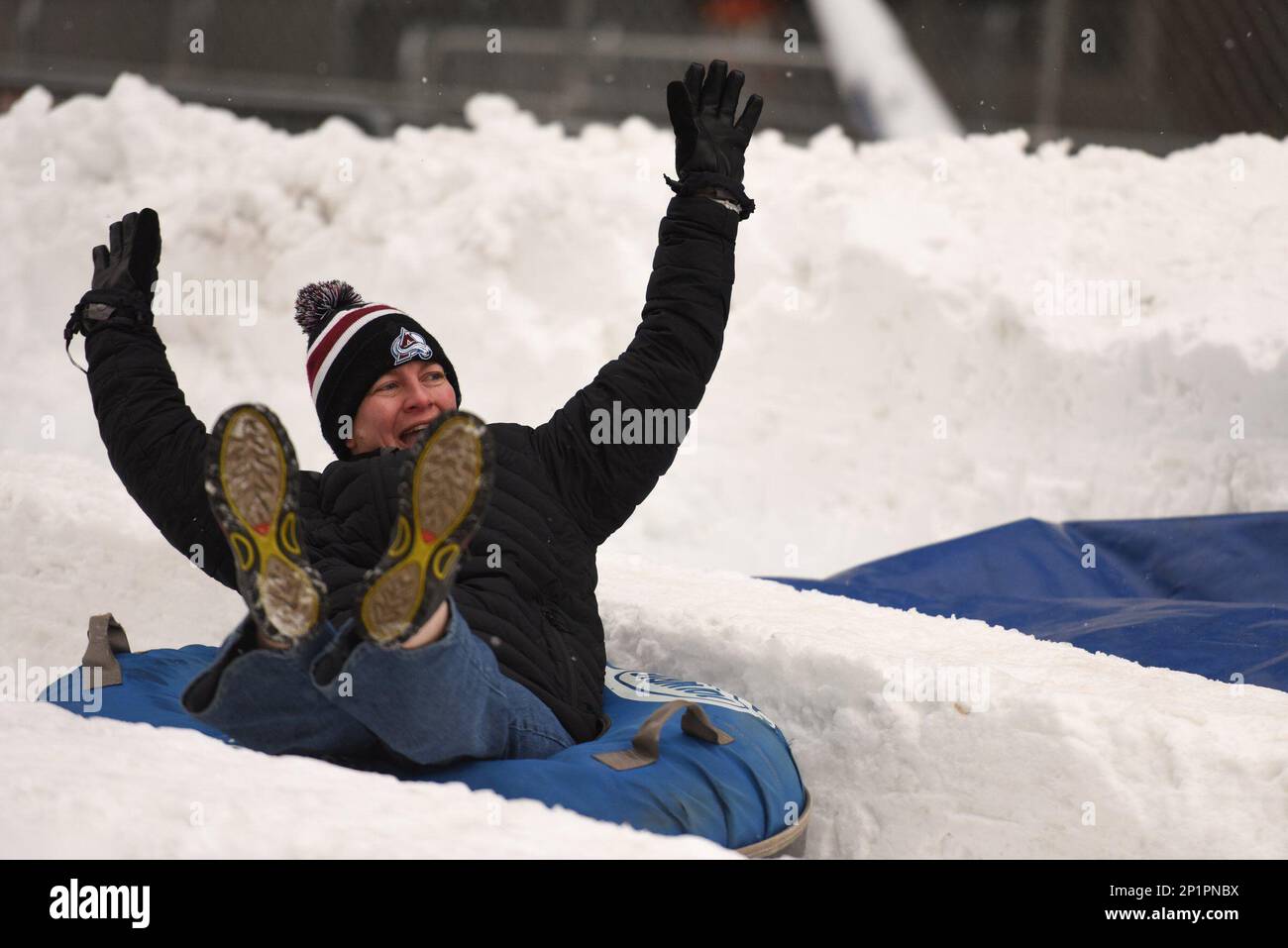 Becky Gartinan, of Denver, Colo.,, puts her hands in the air while ...
