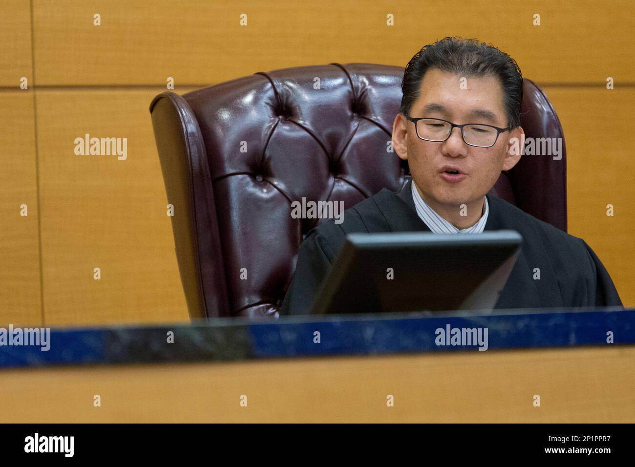 Judge Danny Chun reads the backs the charges against police officer ...