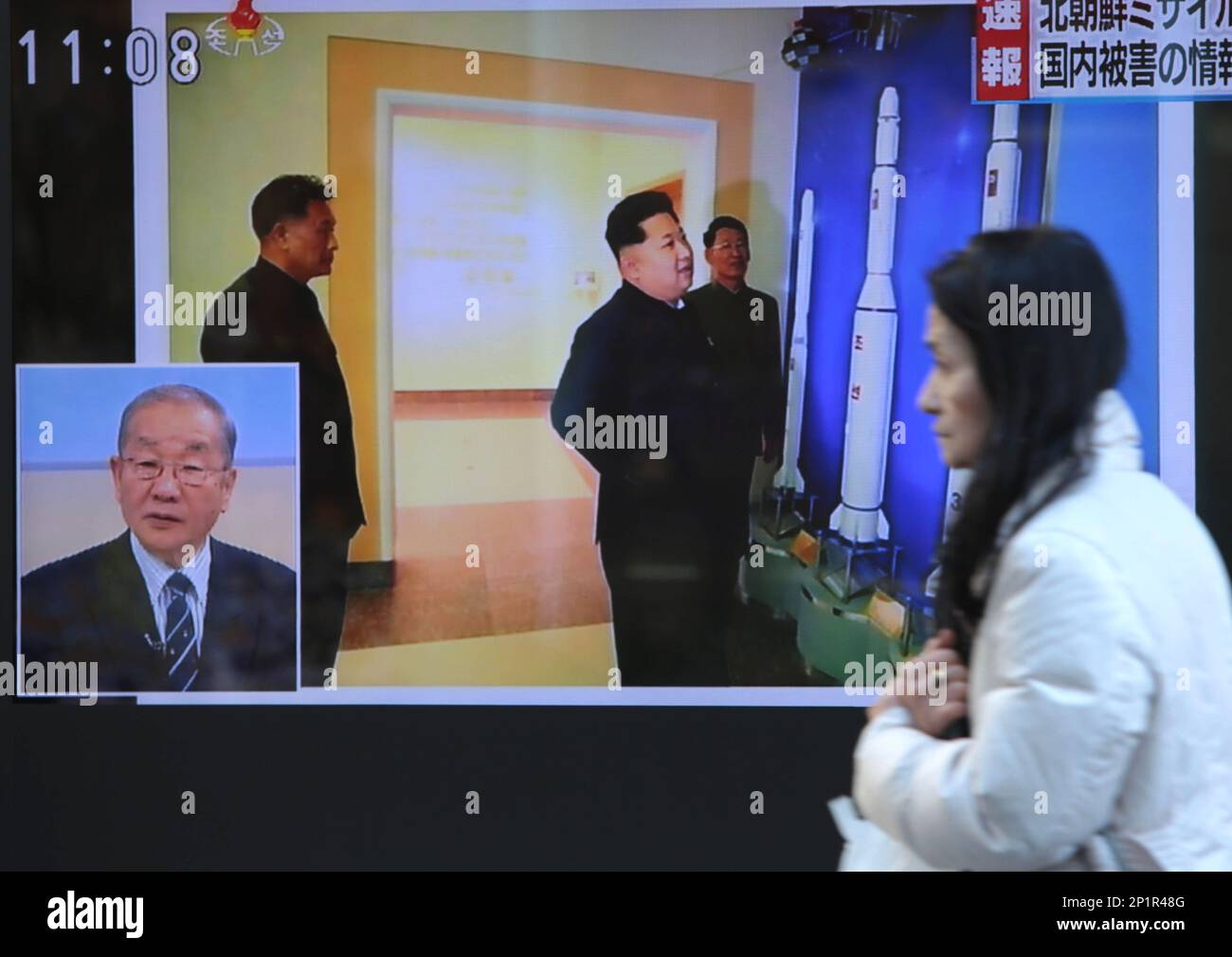 A monitor screen shows North Korean leader Kim Jong Un (C) and a North ...