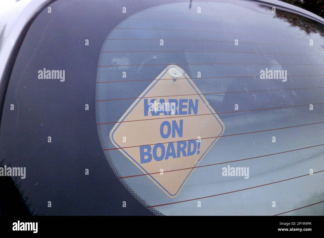 Close-up on a "Karen on board" sign at the back of a car Stock Photo ...