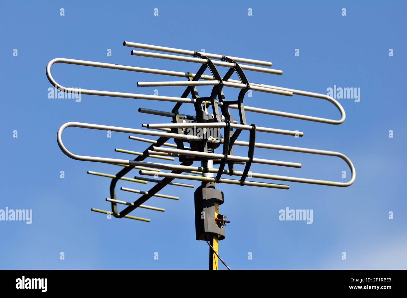 Analog TV antenna blue sky background Stock Photo - Alamy