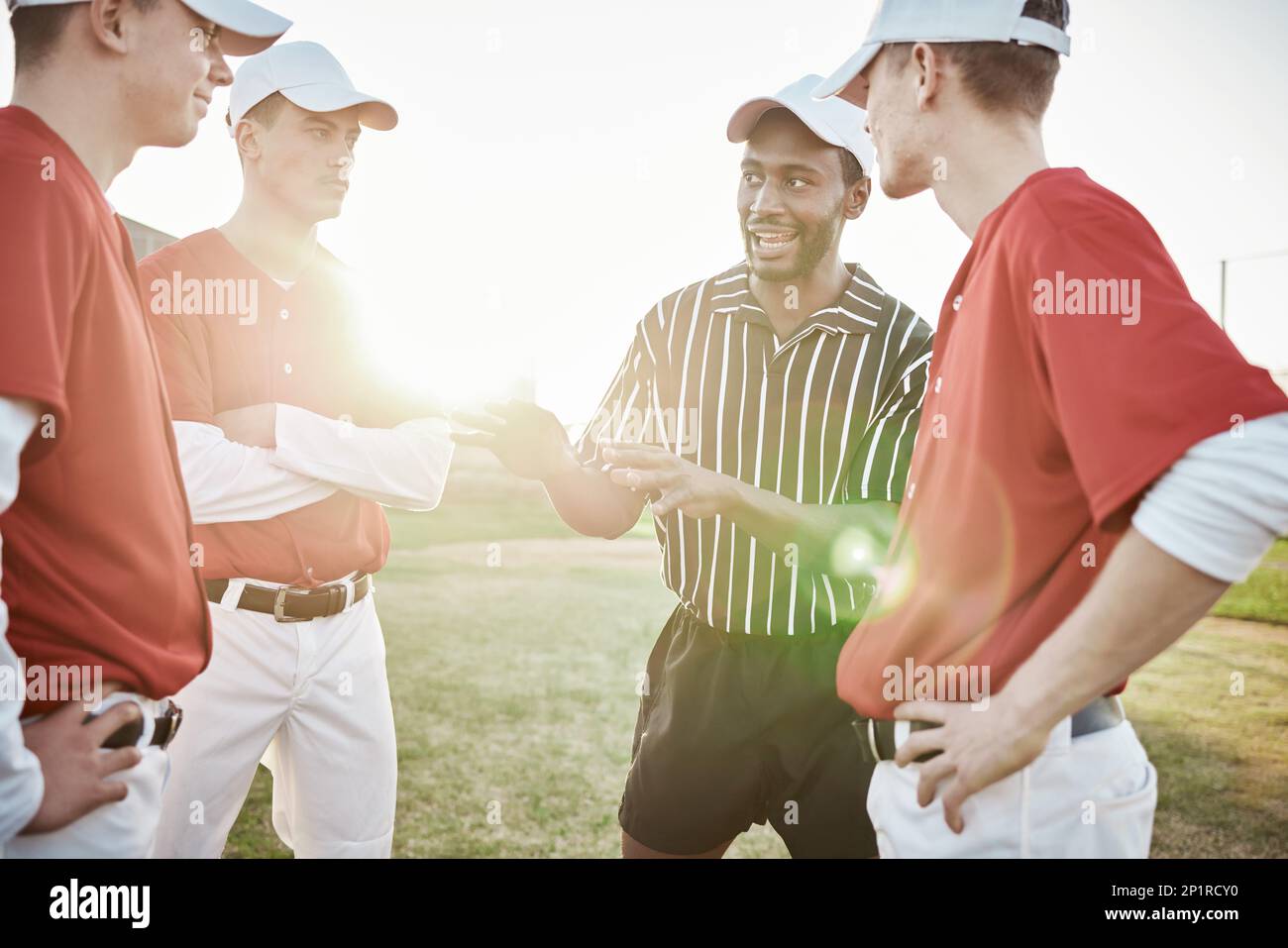 Baseball, coach a strategy with a team outdoor on a field, talking ...
