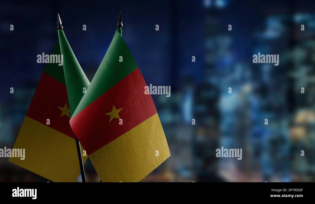 Small flags of the Cameroon on an abstract blurry background Stock ...