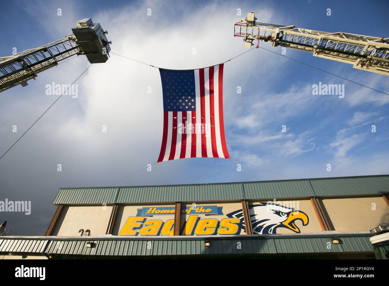 Flags fly outside of Stayton High School for a memorial for Ty Hart in ...