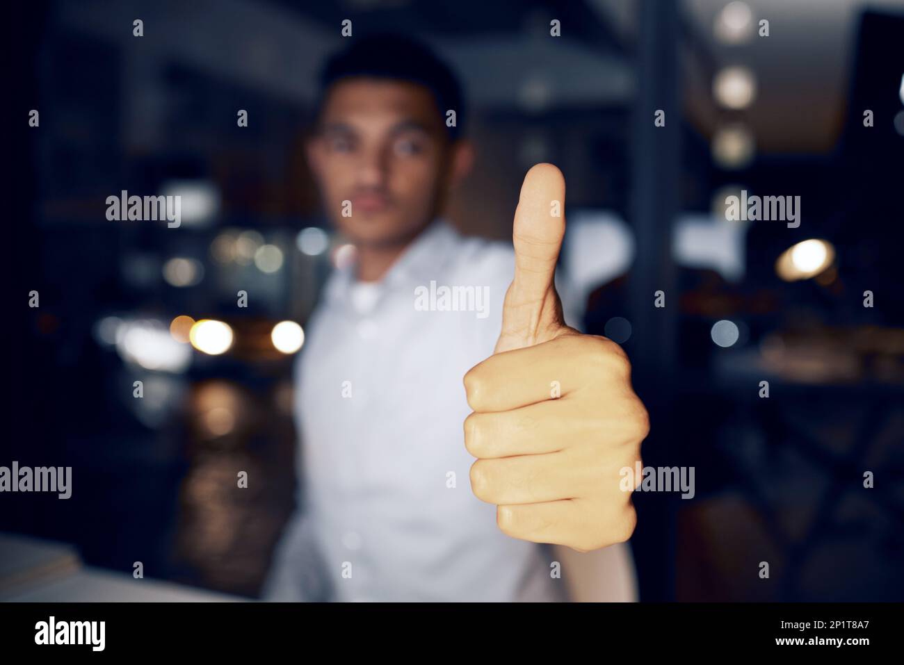 Business man, night and thumbs up in office success, thank you or tech ...