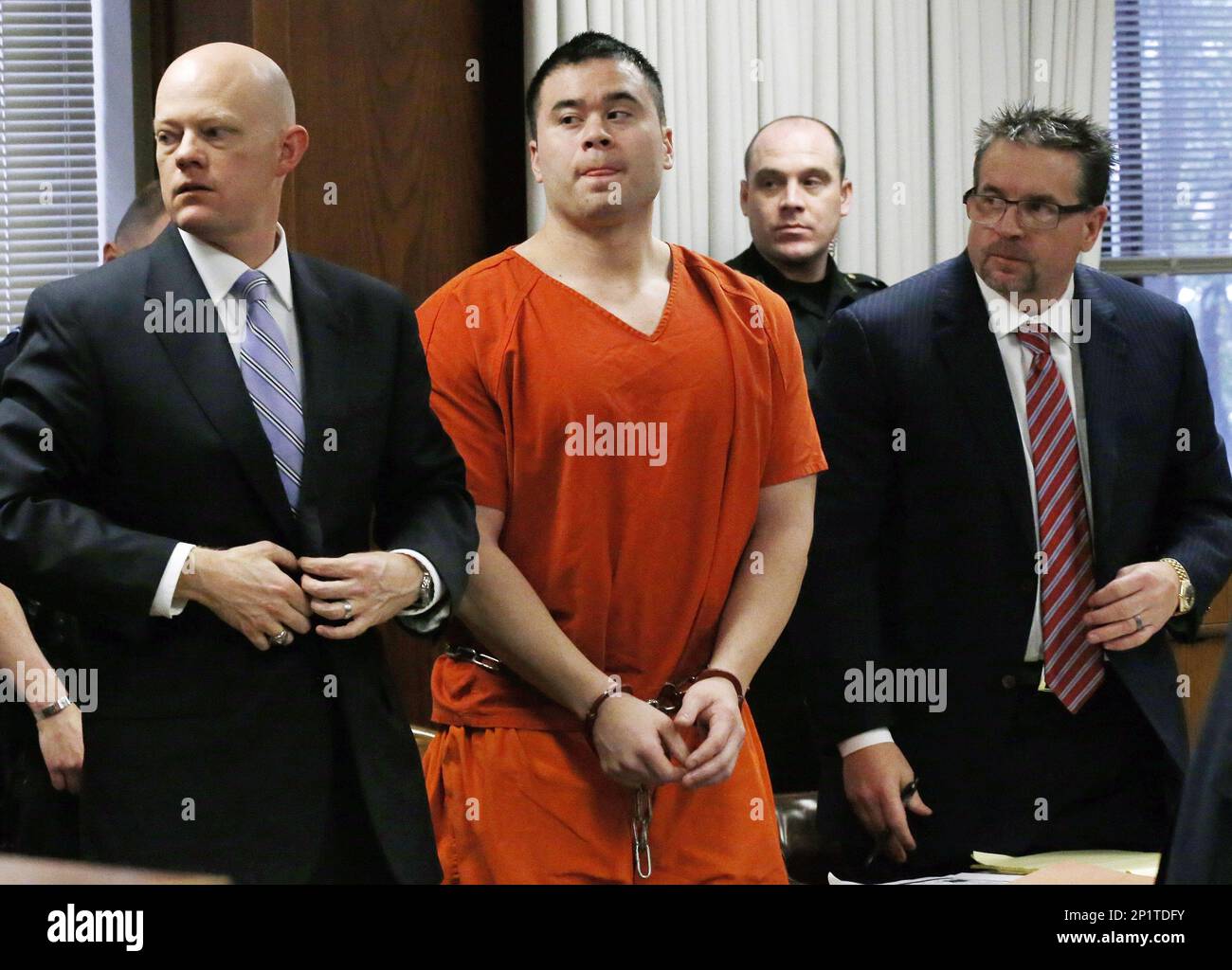 Daniel Holtzclaw, center, stands with his attorneys Robert Gray, left ...