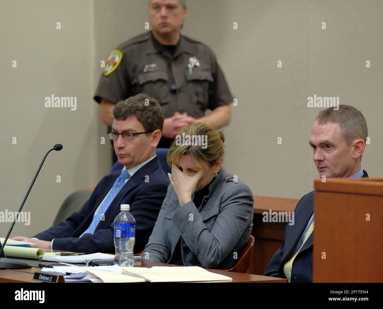 Defense attorney Megan Thomas, seated between Joe King, left, and Chris ...