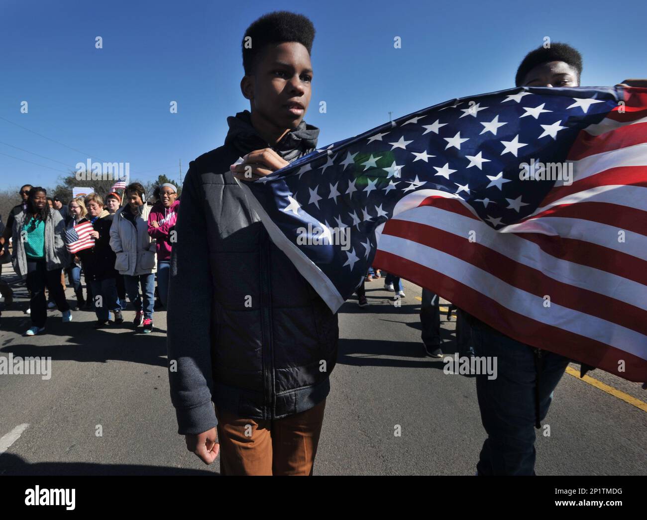 People walk in the annual Martin Luther King Jr. Day march on the MLK ...