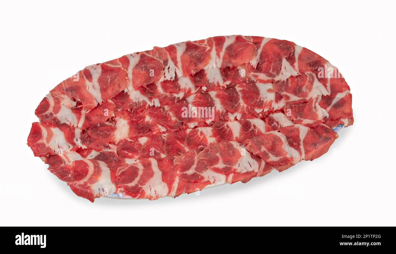 raw beef fillets on a plate over white background Stock Photo - Alamy