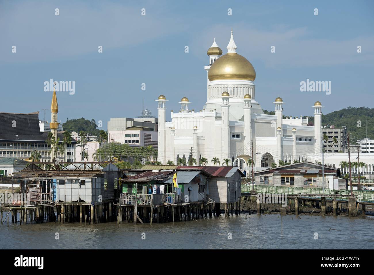 View to the mosque over huts on stilts in the river, Sultan Omar Ali ...