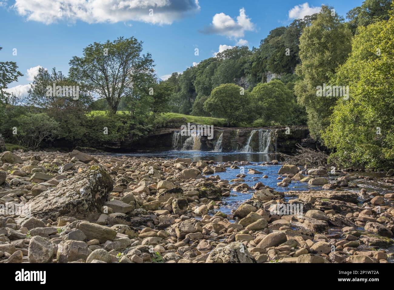 View of cliffs, river and waterfall below limestone cliffs, Wain Wath ...