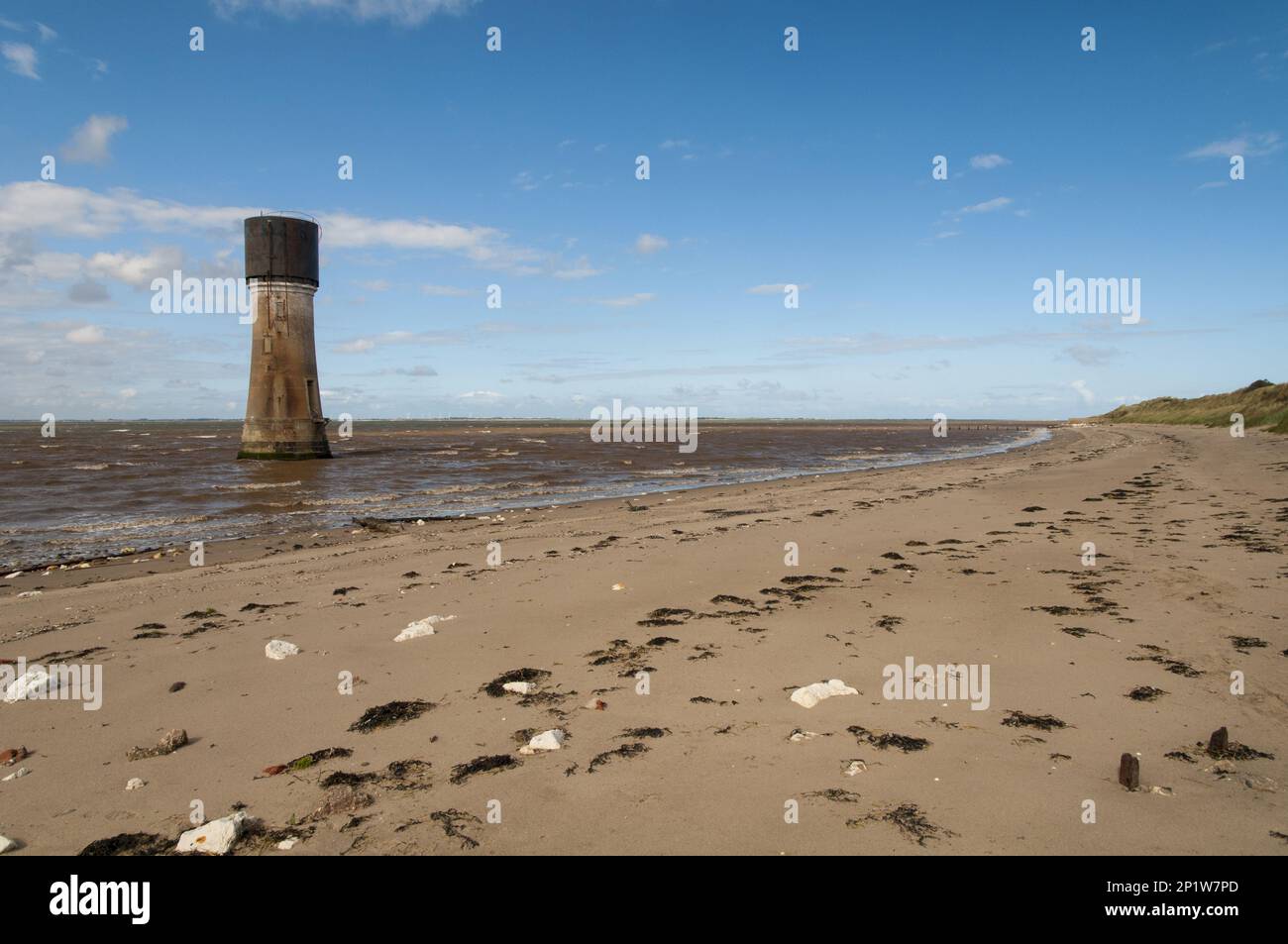 View of beach and former lighthouse converted to water-tower, Low Light ...