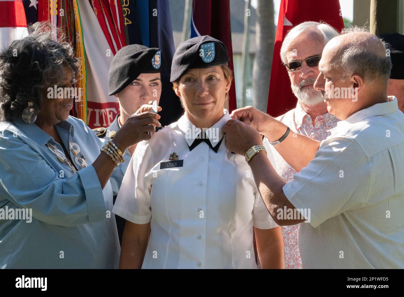 FORT SHAFTER, Hawaii -- Friends change the rank on (center) 18th ...