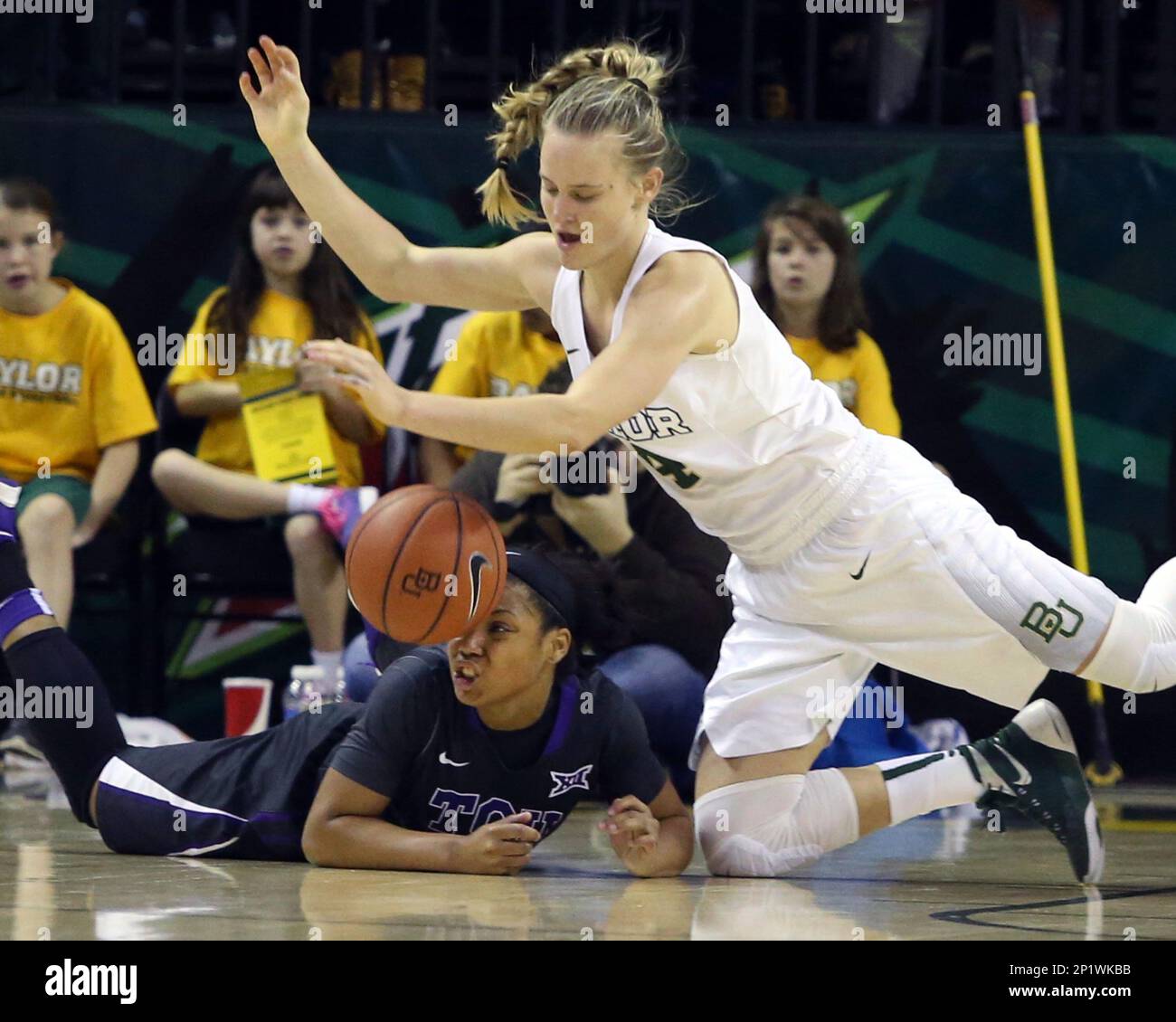 Baylor's Kristy Wallace, top, and TCU's AJ Alix (23) reach for a loose ...