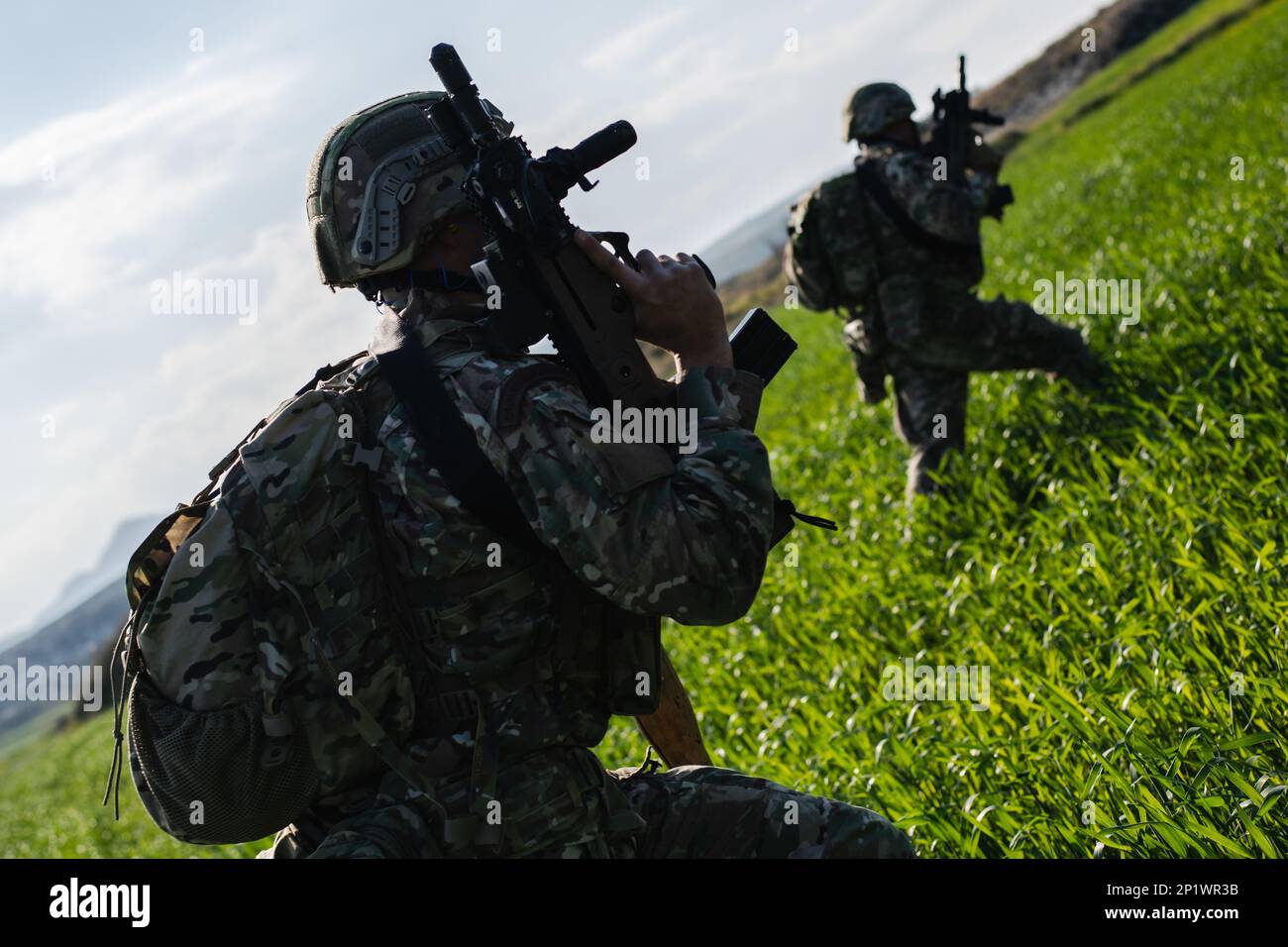 Cypriot soldiers move forward on an objective after being ambushed ...