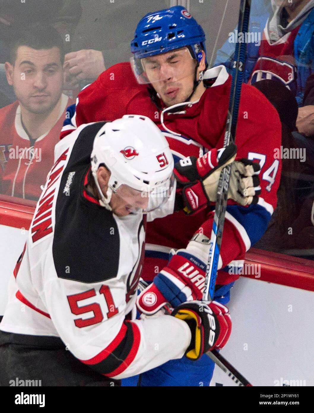 Montreal Canadiens defenseman Alexei Emelin (74) is checked into the ...