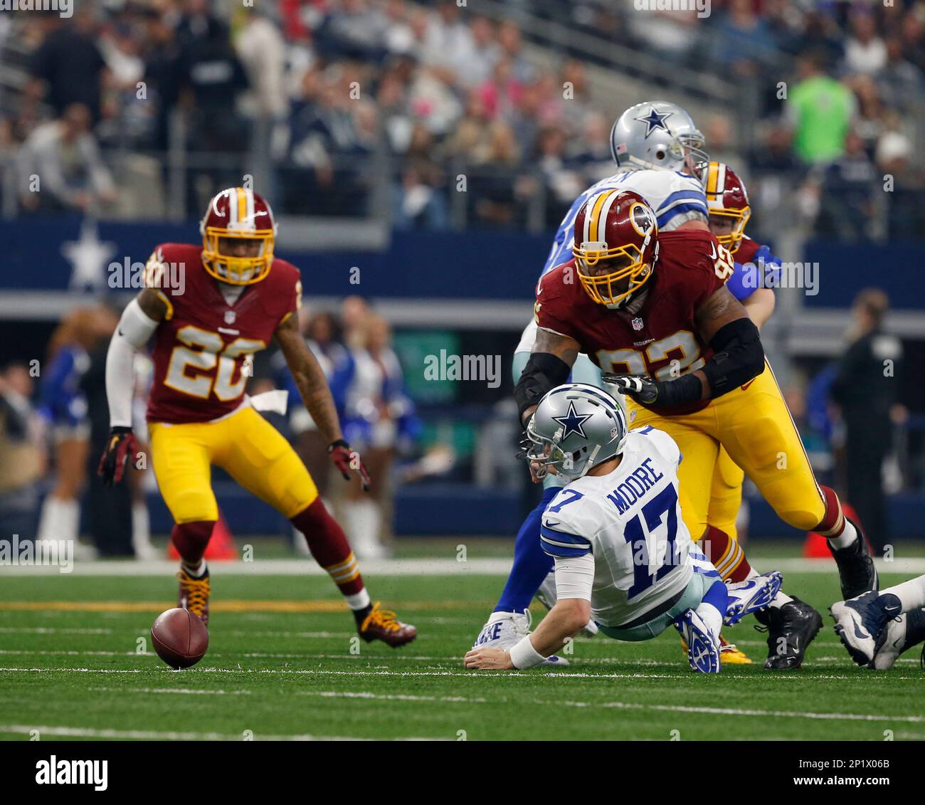 Dallas Cowboys quarterback Kellen Moore (17) looses the football and ...