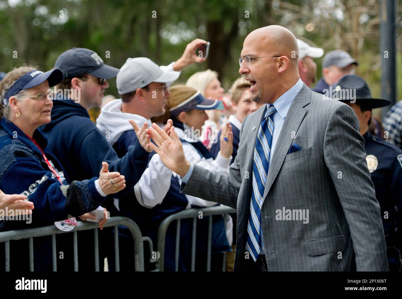 Penn State football coach James Franklin high fives fans he arrives at ...