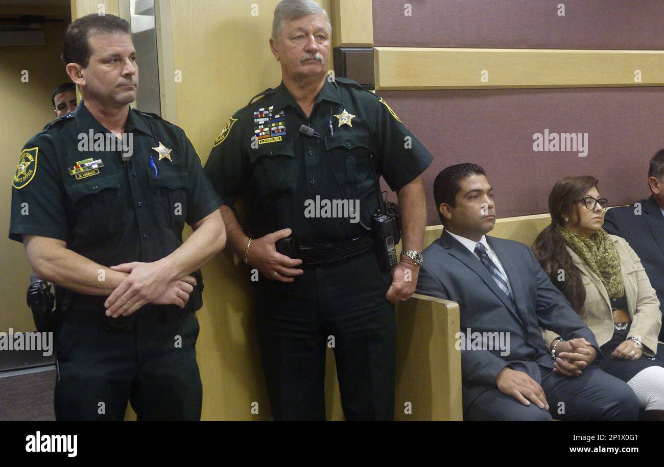Suspended Broward Sheriff's Office Deputy Peter Peraza, second right ...