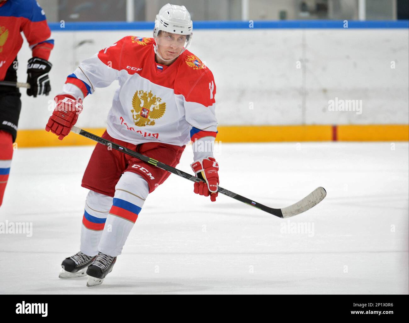 Russian President Vladimir Putin takes part in an ice hockey training ...