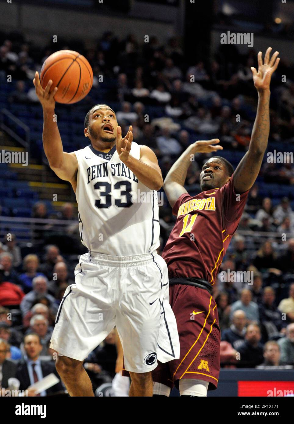 Penn State's Shep Garner (33) drives past Minnesota's Carlos Morris ...