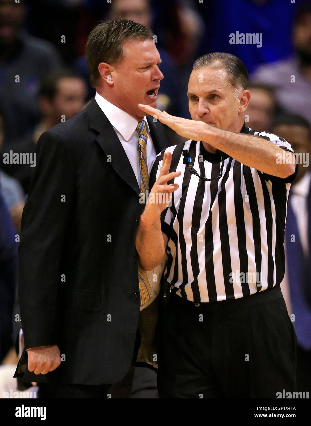 Referee Kelly Self, right, calls a technical foul on Kansas head coach ...