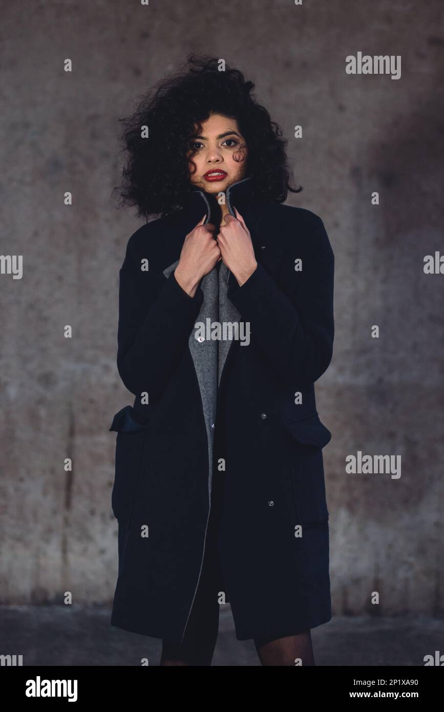 A winter shoot with a model in a wool winter coat in a chilly Stockholm ...